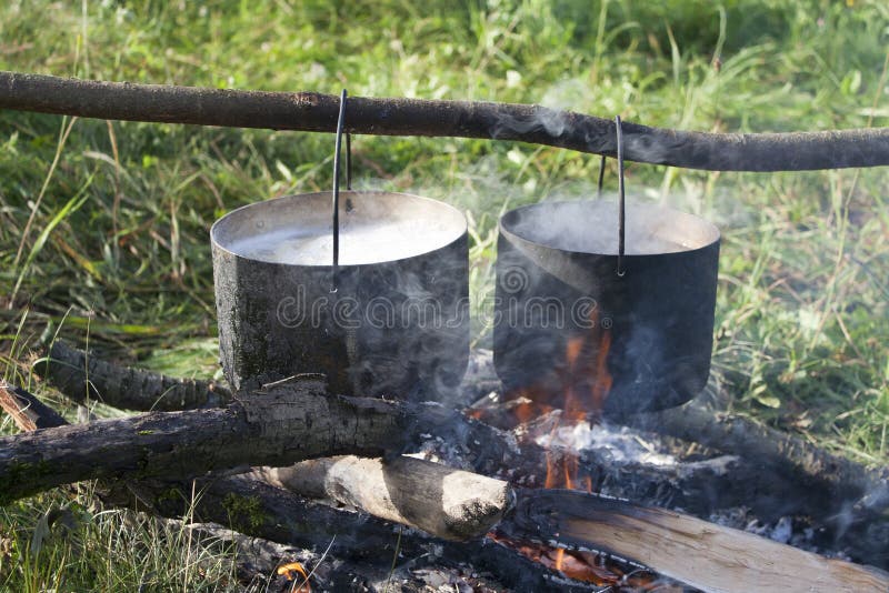 A Pot of Water is Heated on a Fire Made of Branches. Stock Image ...