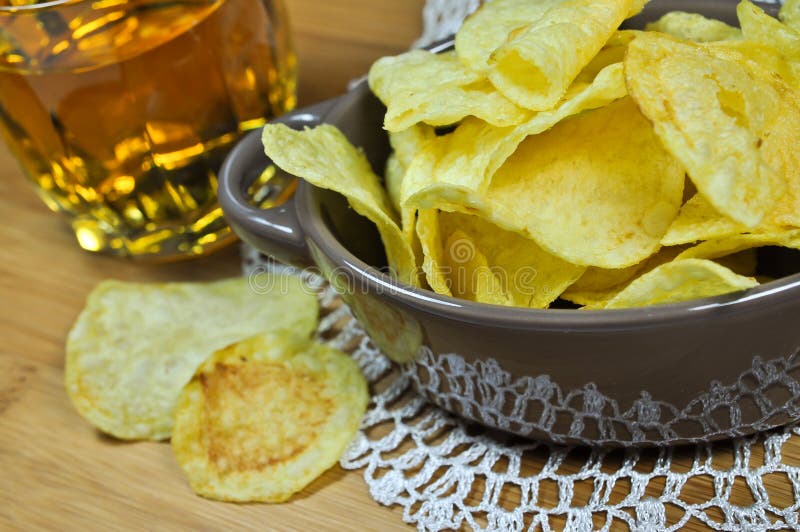 Potato chips and beer stock photo. Image of dish, food - 38291694