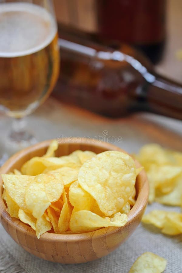 Potato chips and beer stock photo. Image of glass, gold - 60457958
