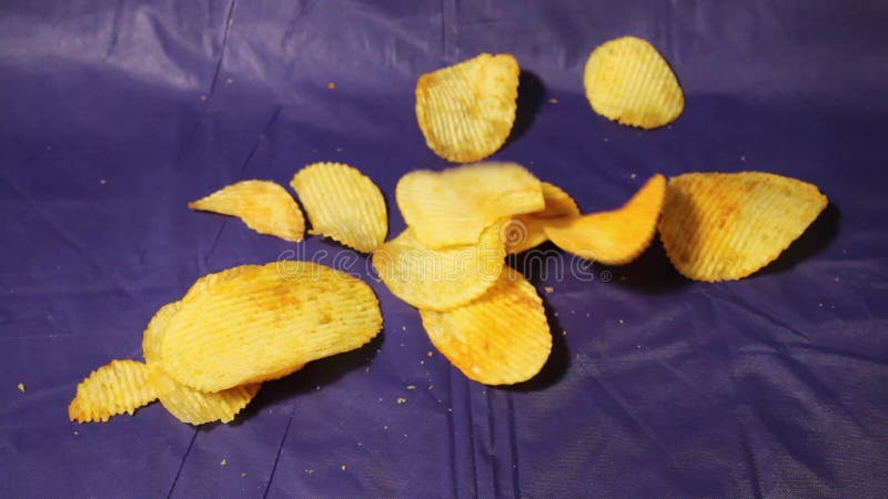 Potato Chips that Fall on Top of the Blue Background. Stock Footage ...