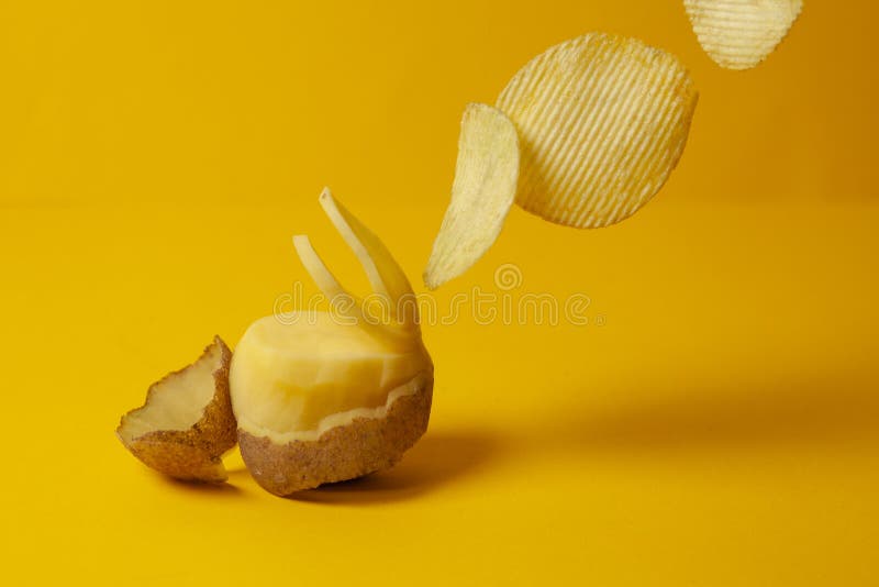 Potato Chips Fly on a Yellow Background, the Process of Making Chips ...