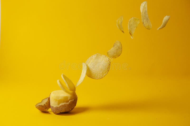 Potato Chips Fly on a Yellow Background, the Process of Making Chips ...