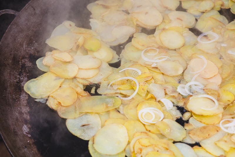 Potato Chips are Fried in a Frying Pan in Oil Stock Image - Image of ...