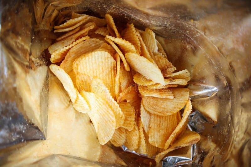 Potato Chips in Open Snack Bag Closeup Stock Photo - Image of golden ...
