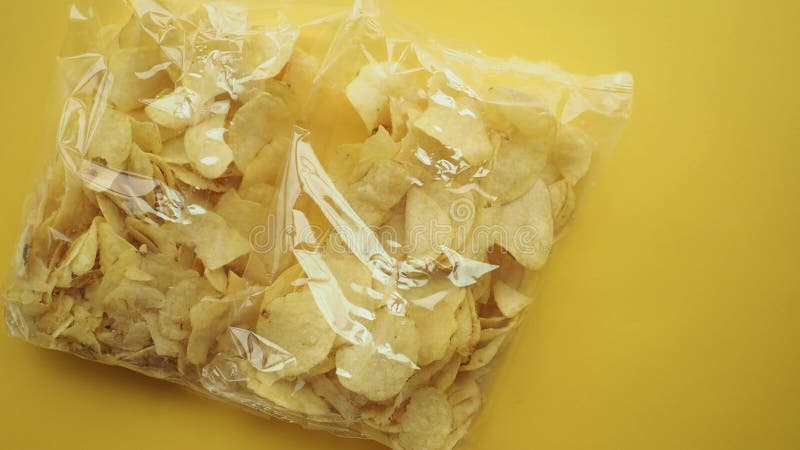 Potato Chips Spilling Form a Packet on Table Stock Video - Video of ...