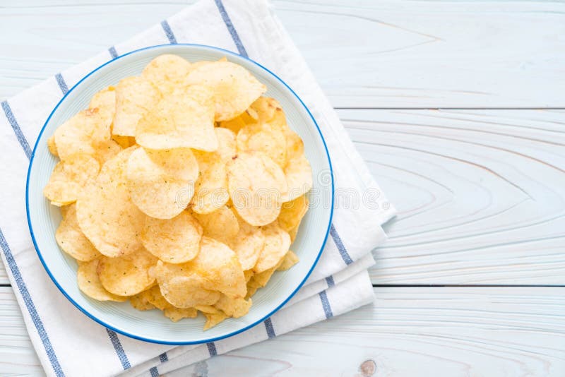 Potato chips on plate stock image. Image of white, delicious - 118417813