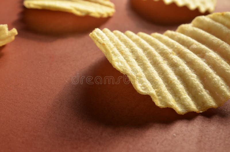 Potato Chips with Ridged or Waves on Brown Surface Stock Image - Image ...