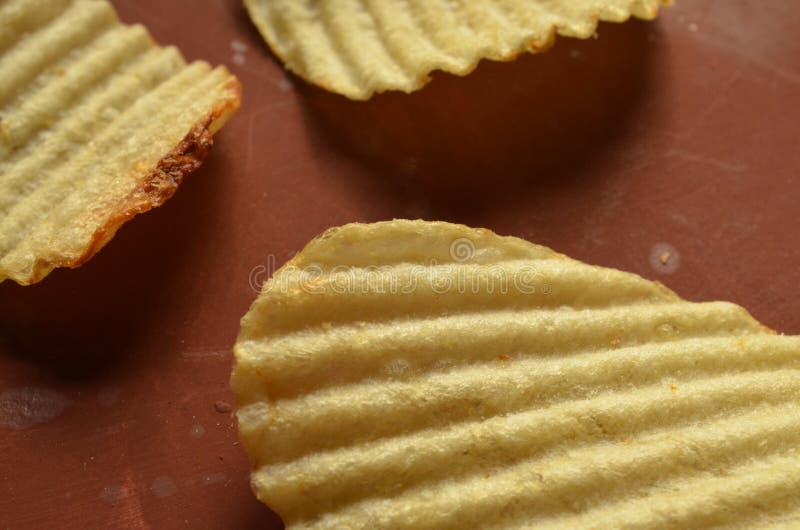 Potato Chips with Ridged or Waves on Brown Surface Stock Image - Image ...