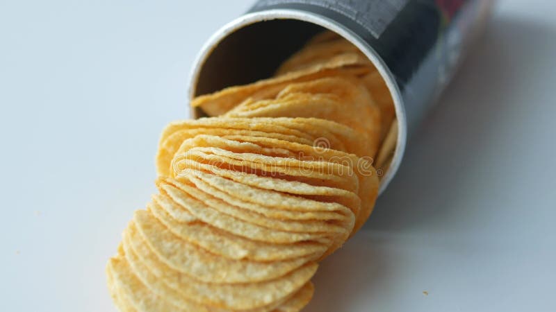 Potato Chips Spilling Form a Packet on Table Stock Video - Video of ...