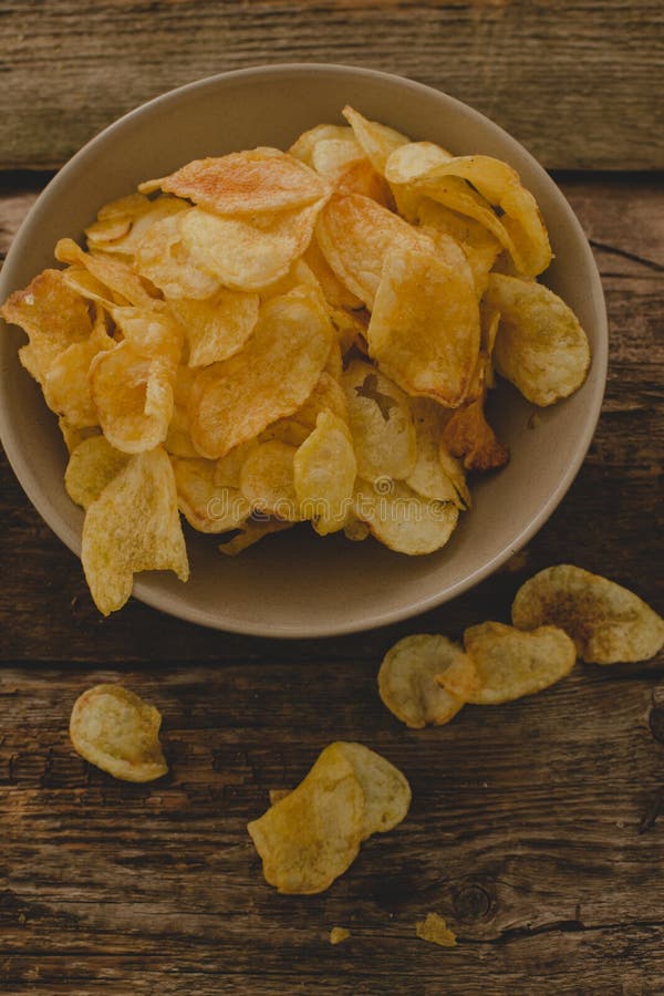 Potato chips on the table stock photo. Image of fatty - 46100550