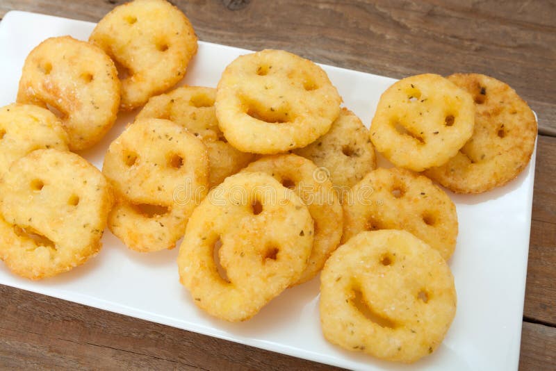 Potato fried smileys chips stock image. Image of heap - 76474765