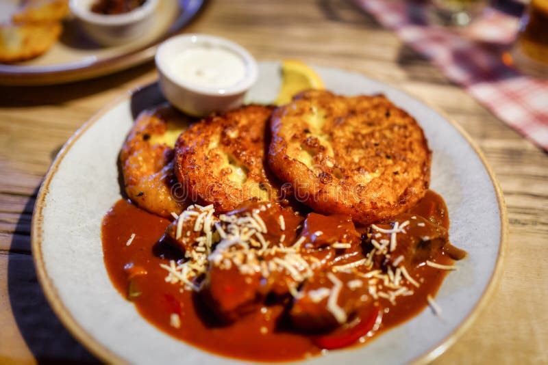 Potato Pancakes with Stew on a Plate in a Restaurant Stock Image ...