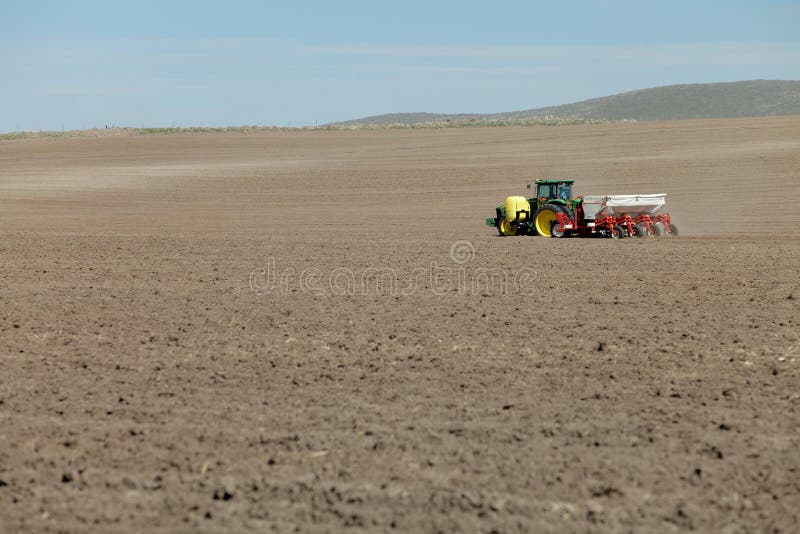 A Tractor Puling a Potato Planting Implement. Editorial Photography ...