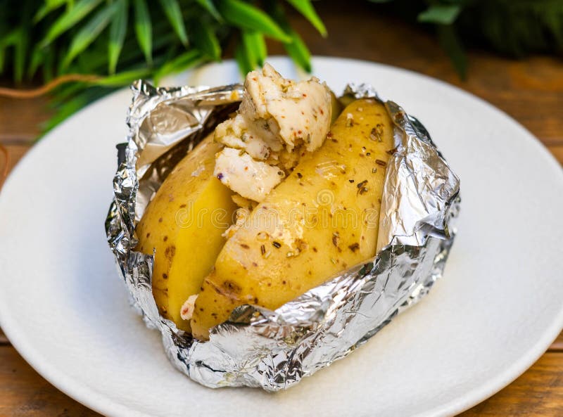 Potato Roasted Over Fire with Butter Stock Image - Image of firewood ...