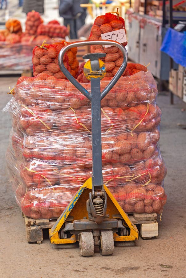 Potato Sacks Pallet Jack stock image. Image of handle - 352869429