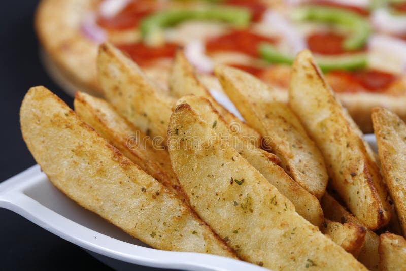 Potato wedges and pizza stock image. Image of pizza, spicy - 12732989