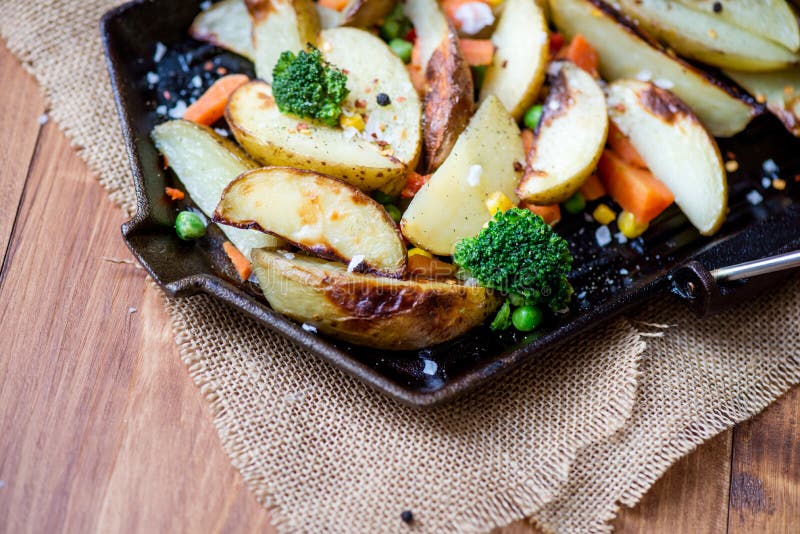 Potato Wedges with Vegetables on Iron Cast Pan Stock Image - Image of ...