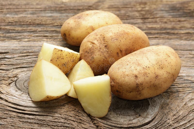 Potato on wooden table stock image. Image of casserole - 91004087