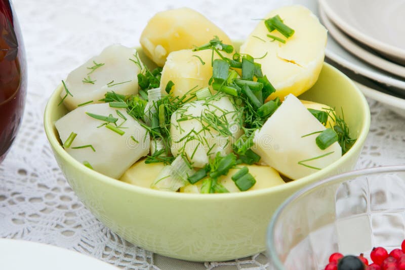 Potatoes Cooked in a Round Dish. Chopped Fresh Herbs Stock Photo ...