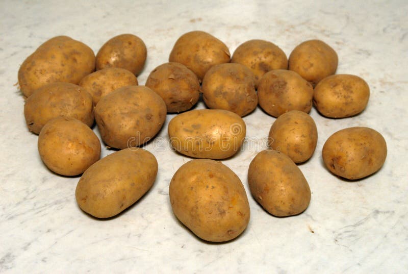 Potatoes on a White Kitchen Table. Stock Image - Image of rounded ...