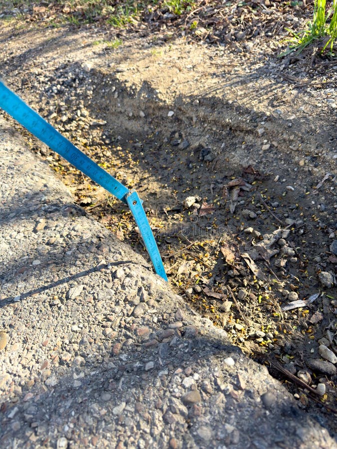 Pothole on a German road stock photo. Image of repair - 313777670