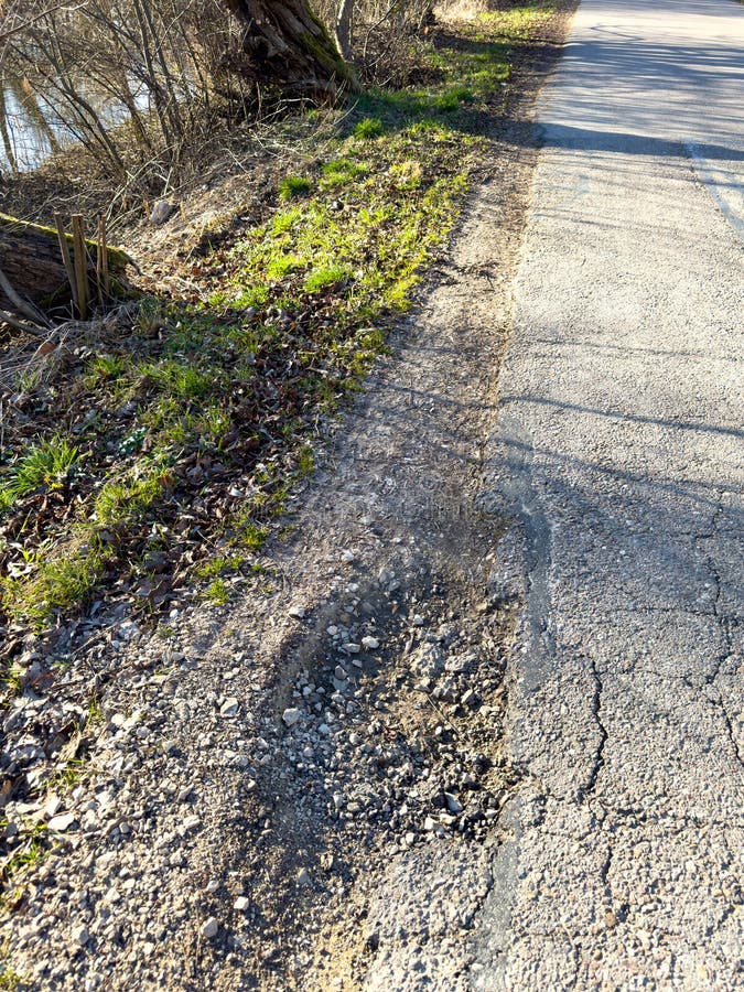 Pothole on a German road stock image. Image of water - 313777519