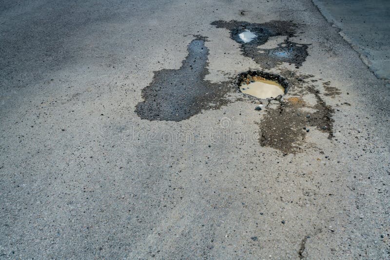 Pothole on the road stock image. Image of rain, damage - 99629453