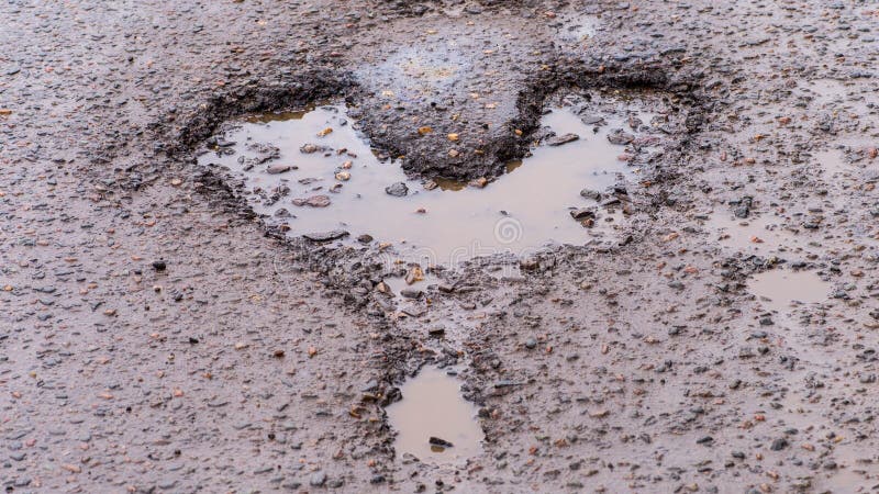The pothole in the road stock image. Image of beware - 89004563