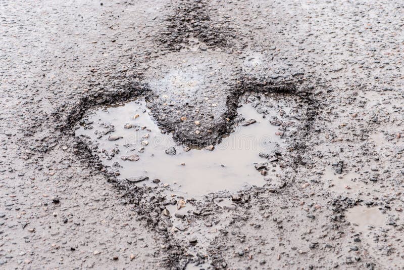 The pothole in the road stock photo. Image of repair - 89004900