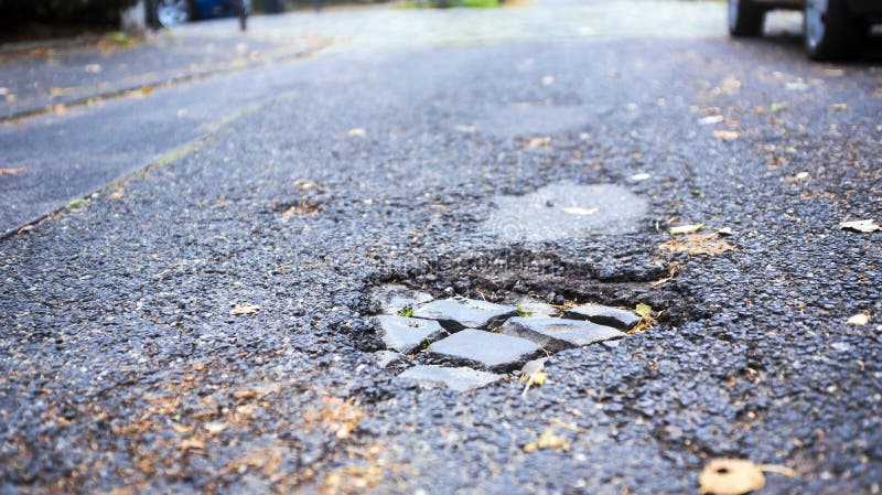 Pothole in the street stock photo. Image of highway - 108067830
