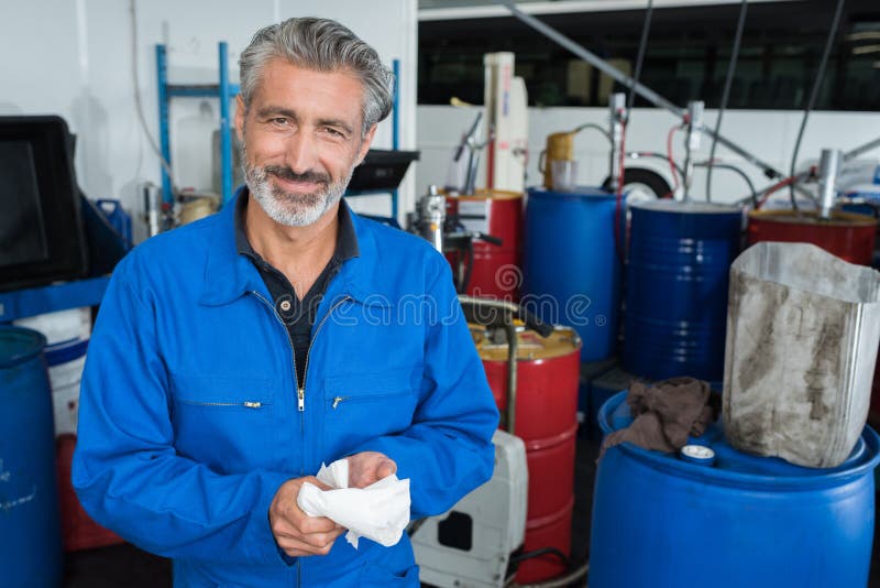 Potrait happy mechanic man stock photo. Image of attractive - 200447648