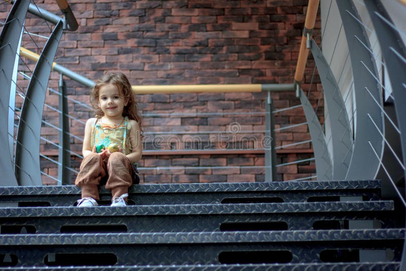 Potrait of Young Kid Girl on a Up Stairs. Stock Photo - Image of ...