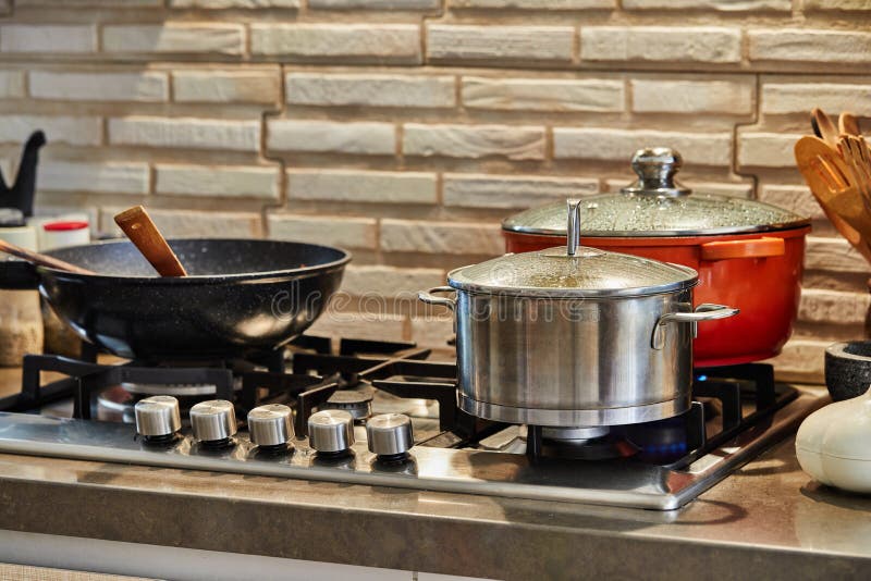Pots with Cooking Food in the Kitchen on Gas Stove Stock Image - Image ...
