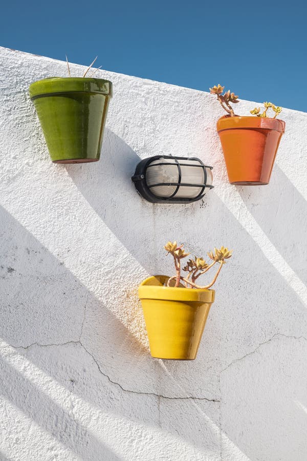 Pots of Different Colors with Glitter on a Whitewashed Wall Stock Photo ...