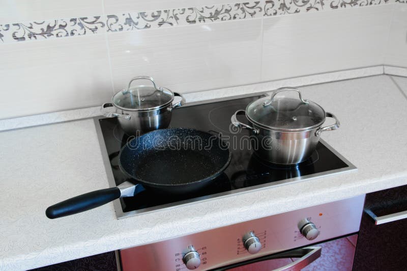 Pots and a frying pan stock photo. Image of food, modern - 30931464