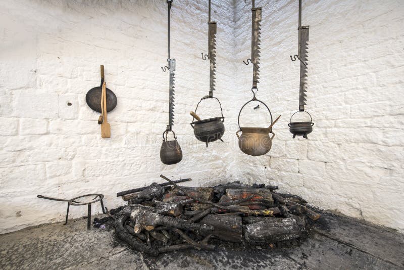 Pots hanging over a fire stock photo. Image of implements - 47873354