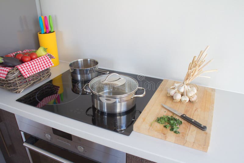 Pots on kitchen stove stock image. Image of modern, cookware - 87847489