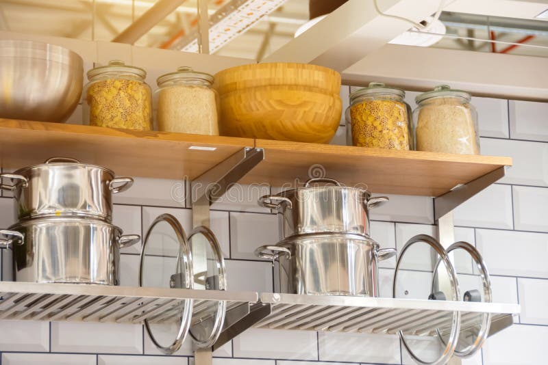 Pots and Lids with Jars for Food Storage on Kitchen Shelves Stock Image ...