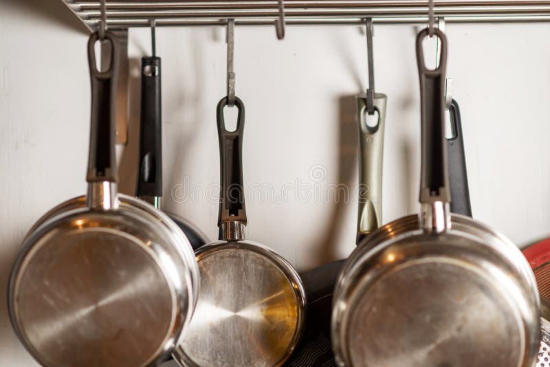 Pots and Pans Hang in the Kitchen. Kitchen Utensils, Home Interior ...
