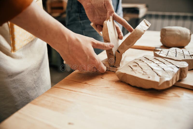 Potter Cuts Large Piece of Clay into Pieces with String Stock Photo ...
