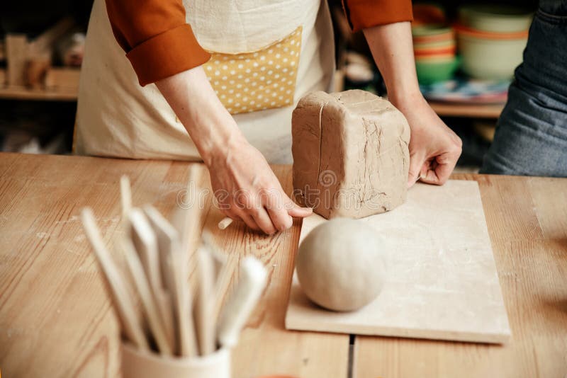 Potter Cuts Large Piece of Clay into Pieces with String Stock Image ...