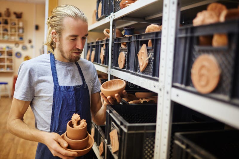 Potter with earthenware stock photo. Image of occupation - 82534918