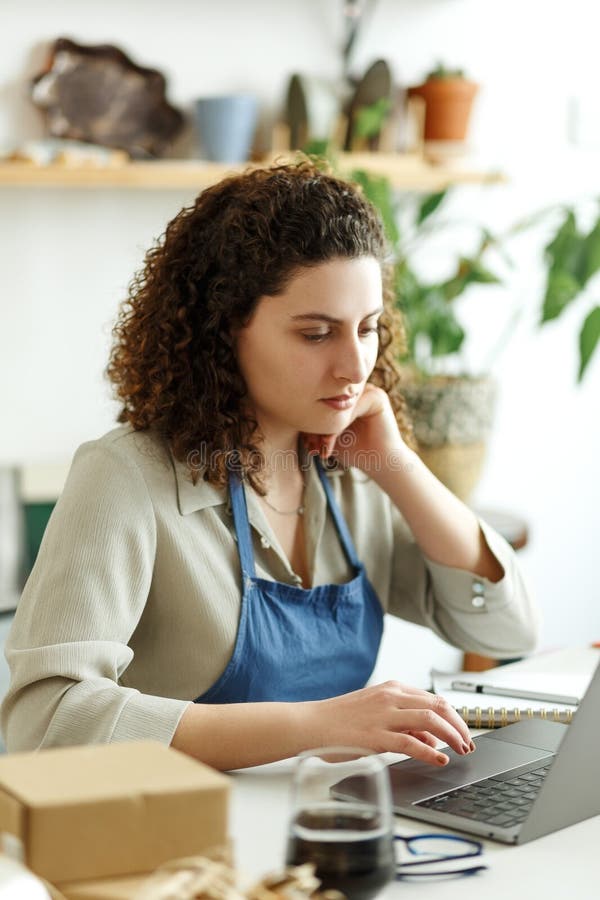 Potter Entrepreneur Using Laptop in Workshop, Smiling Stock Image ...