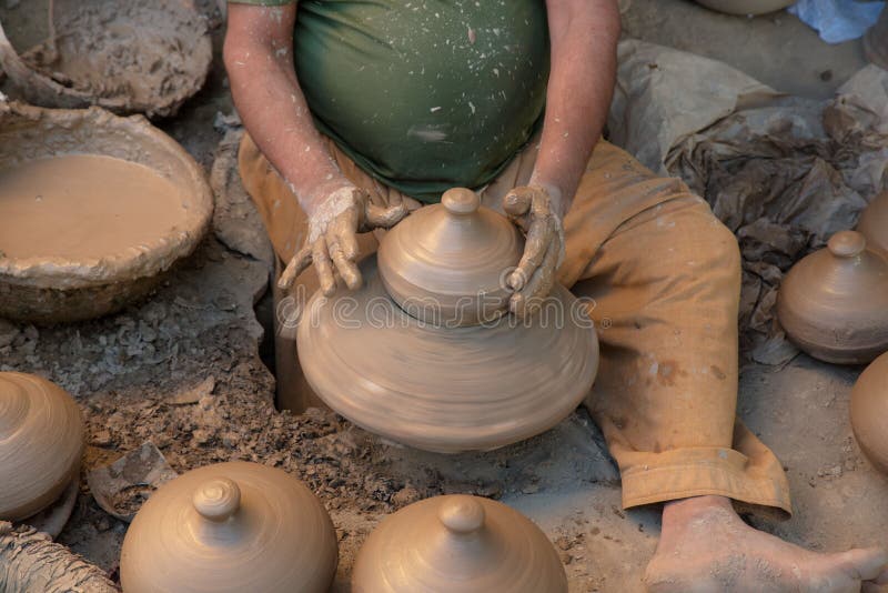 A Potter and a Group of Pots on Chalk Stock Photo - Image of lamps ...