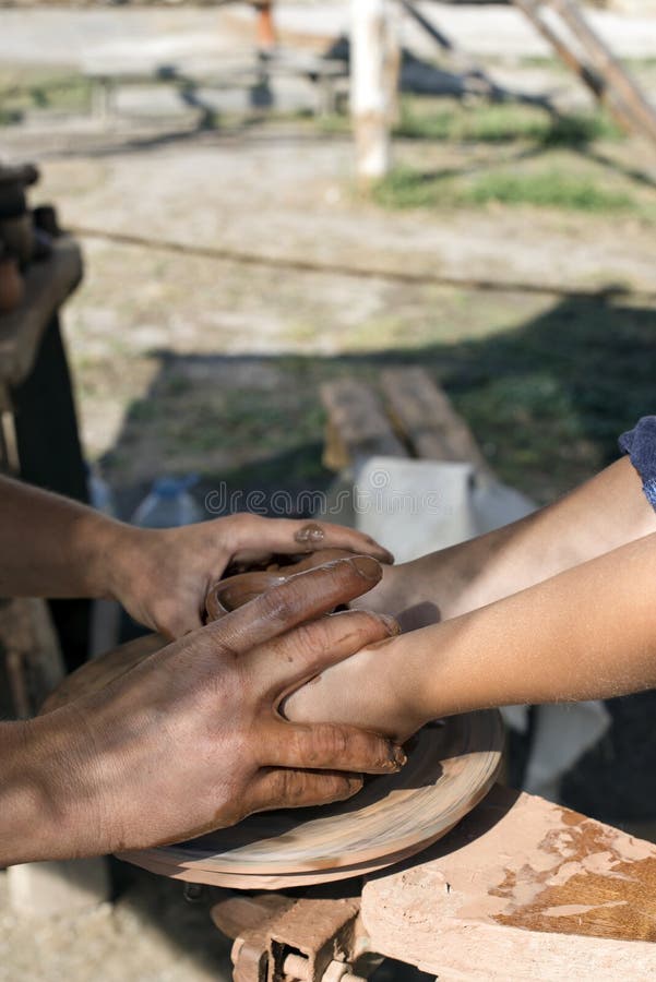 Potter Hands Guides the Child`s Hand Stock Photo - Image of hobby ...