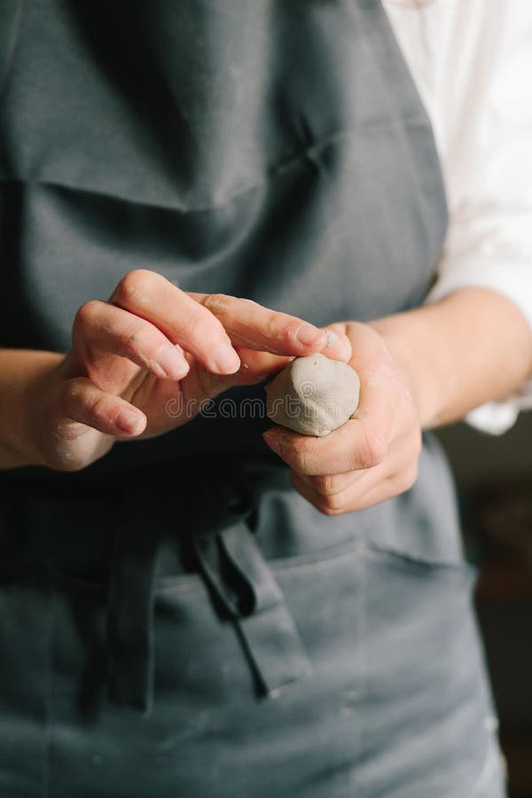 Potter Holds a Piece of Wet Clay in Their Hands, Molds it into Form ...