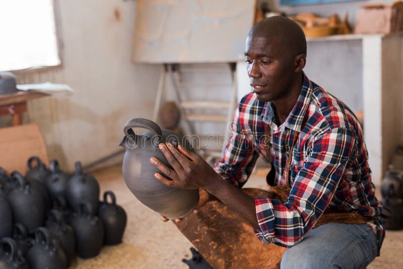 Potter Looking at Clay Dishware Stock Photo - Image of ceramist ...