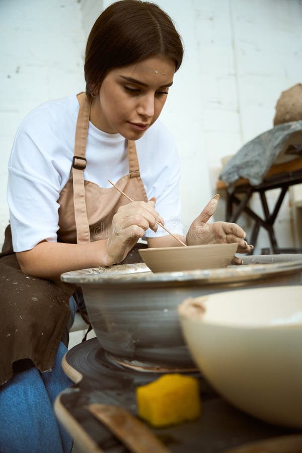 Potter Maker in Apron Working with Clay on Pottery Wheel in Workshop ...