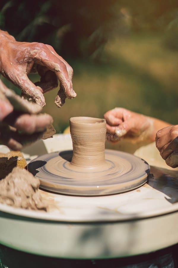 Potter Making a Clay Object on Pottery Wheel in Outdoors. Craftsman ...