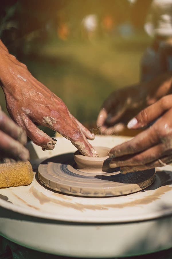 Potter Making a Clay Object on Pottery Wheel in Outdoors. Craftsman ...
